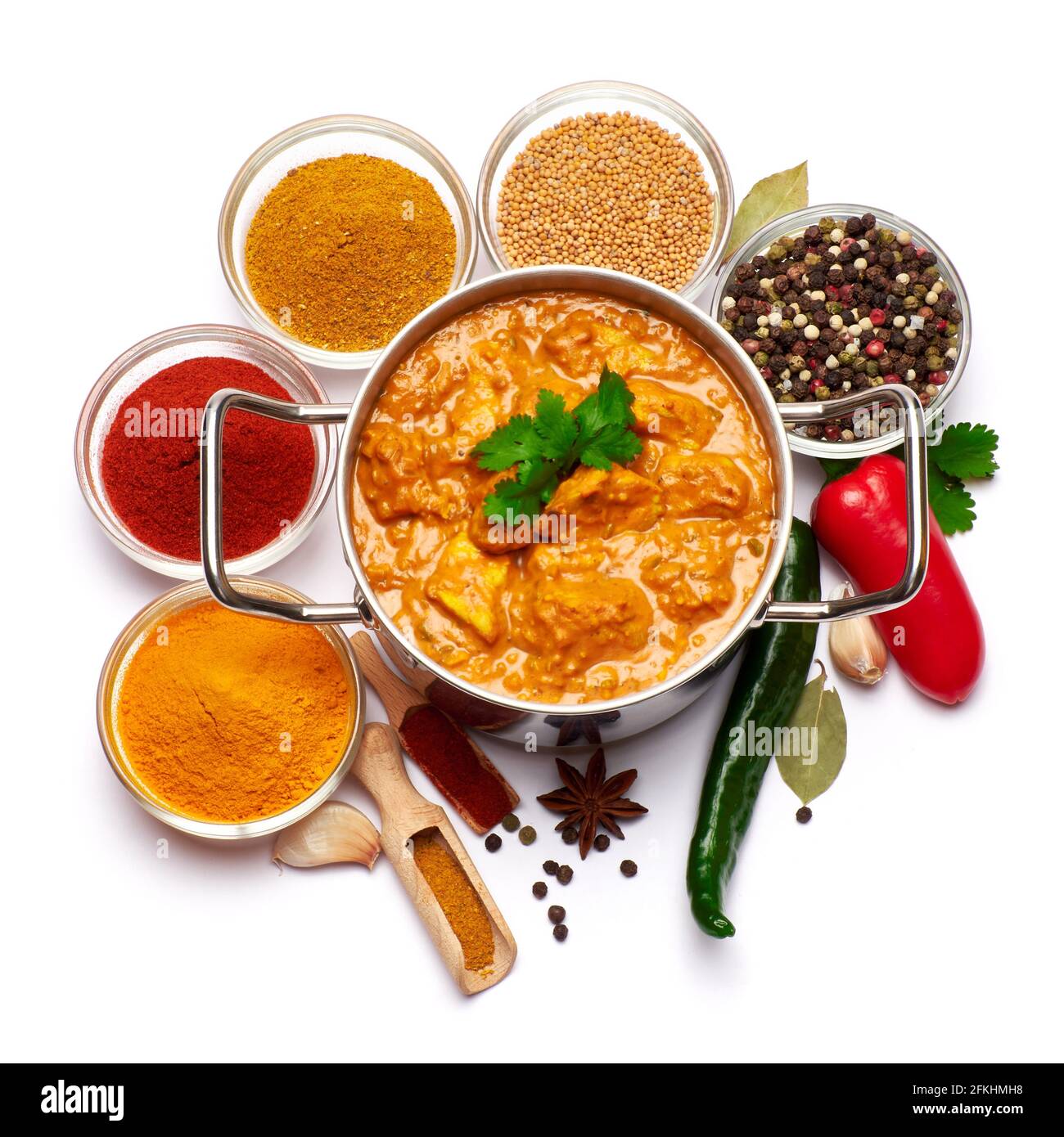 Pot of Traditional Chicken Curry and set of spices on white background ...