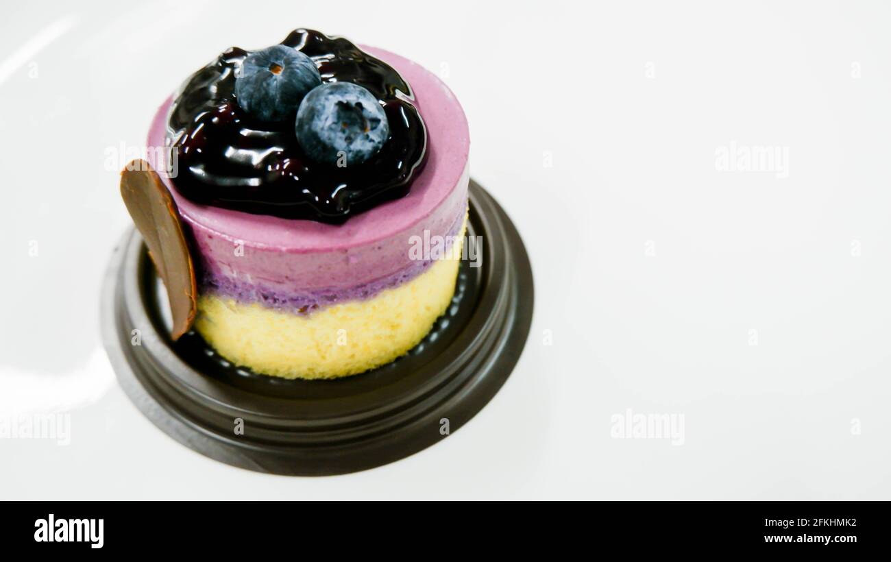 A blueberry dessert on top blue filling Stock Photo - Alamy