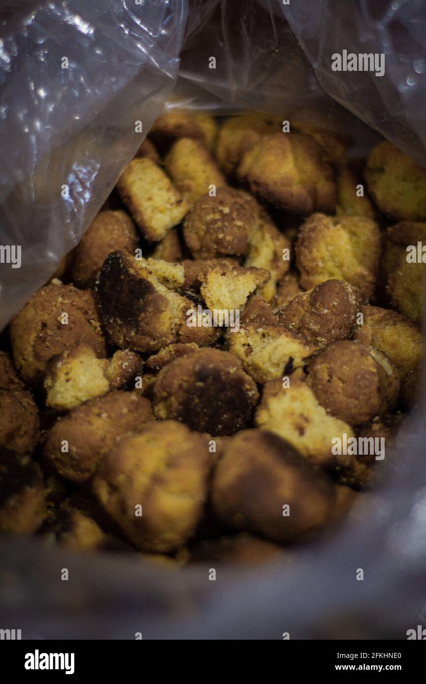 A vertical closeup of bread used for Holy Communion celebrated by ...