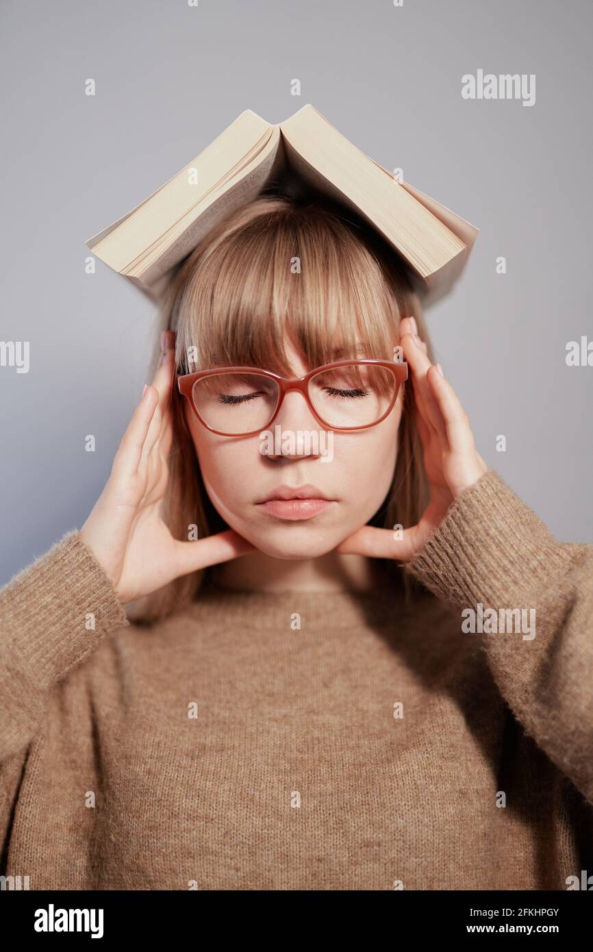 Beautiful caucasian female university student wearing eyeglasses and ...