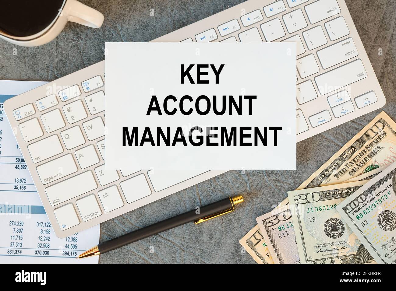 KEY ACCOUNT MANAGEMENT is written in a document on the office desk with ...