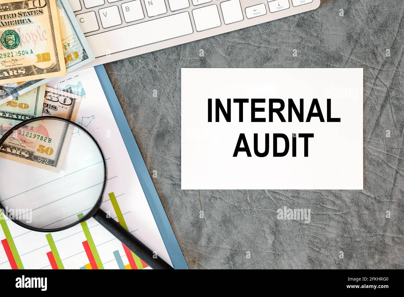 INTERNAL AUDIT is written in a document on the office desk with office ...