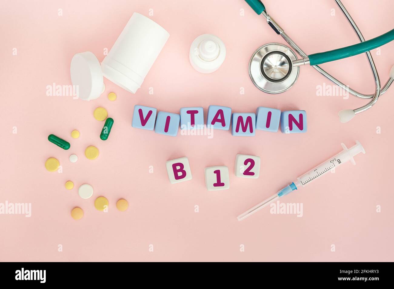 Cubes with the text Medical supplies on the table with tablets and a ...