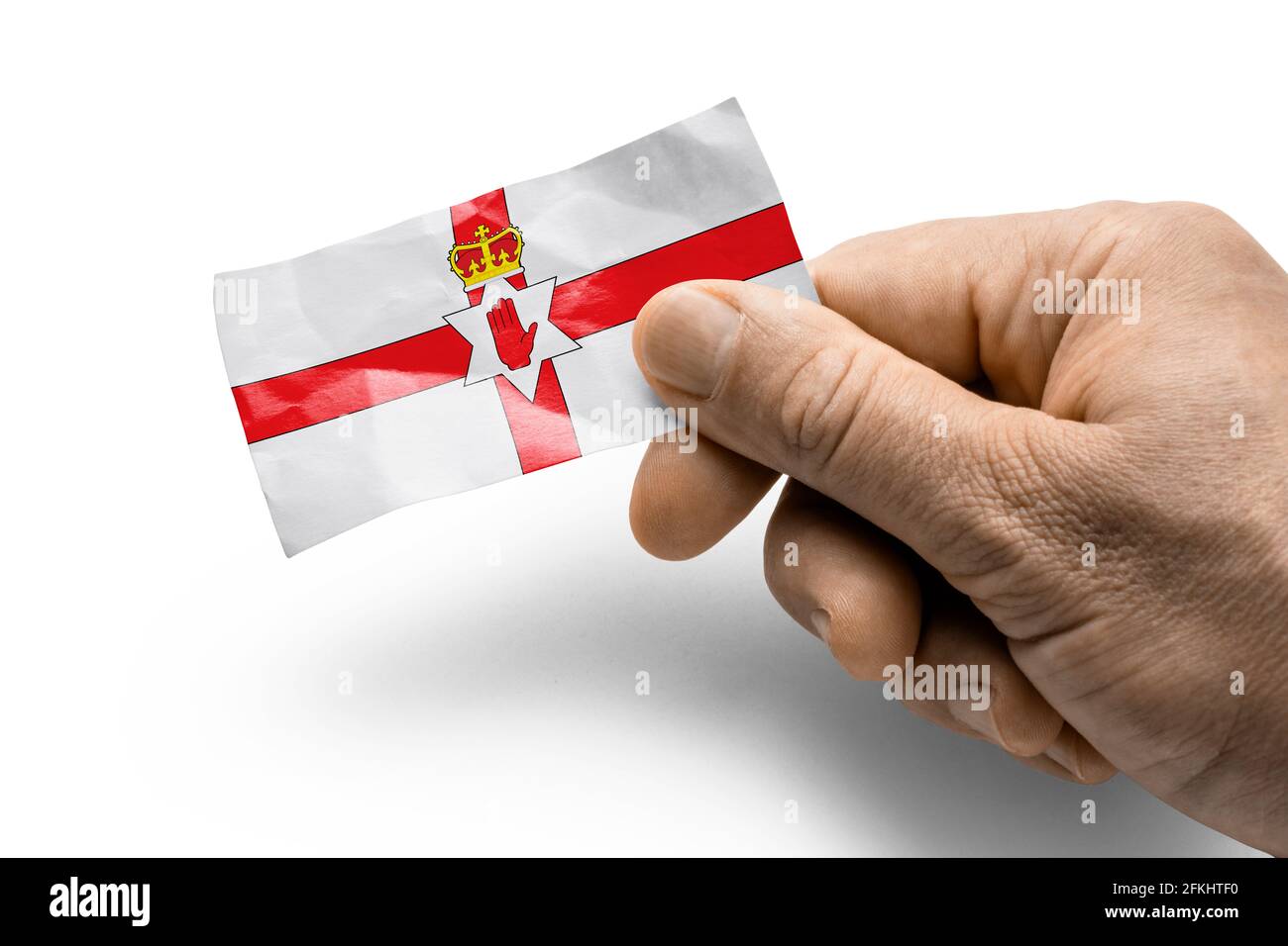Hand holding a card with a national flag the Northern Ireland Stock ...