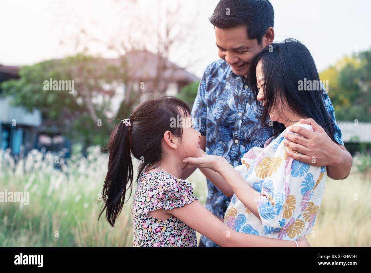 Happy Family hugging and talking with happily Stock Photo - Alamy