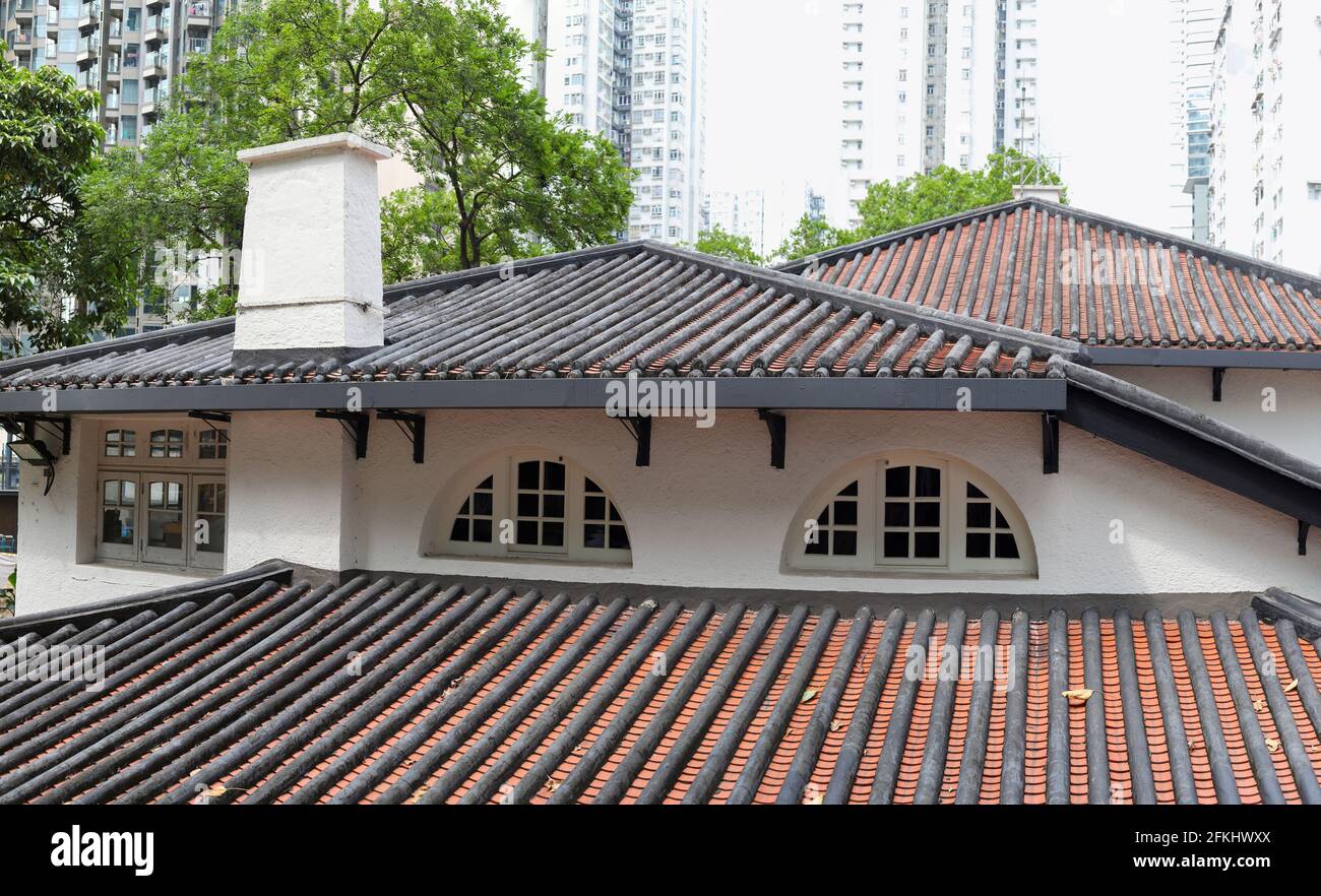 roof tiles of a historical traditional Chinese building with red bricks ...