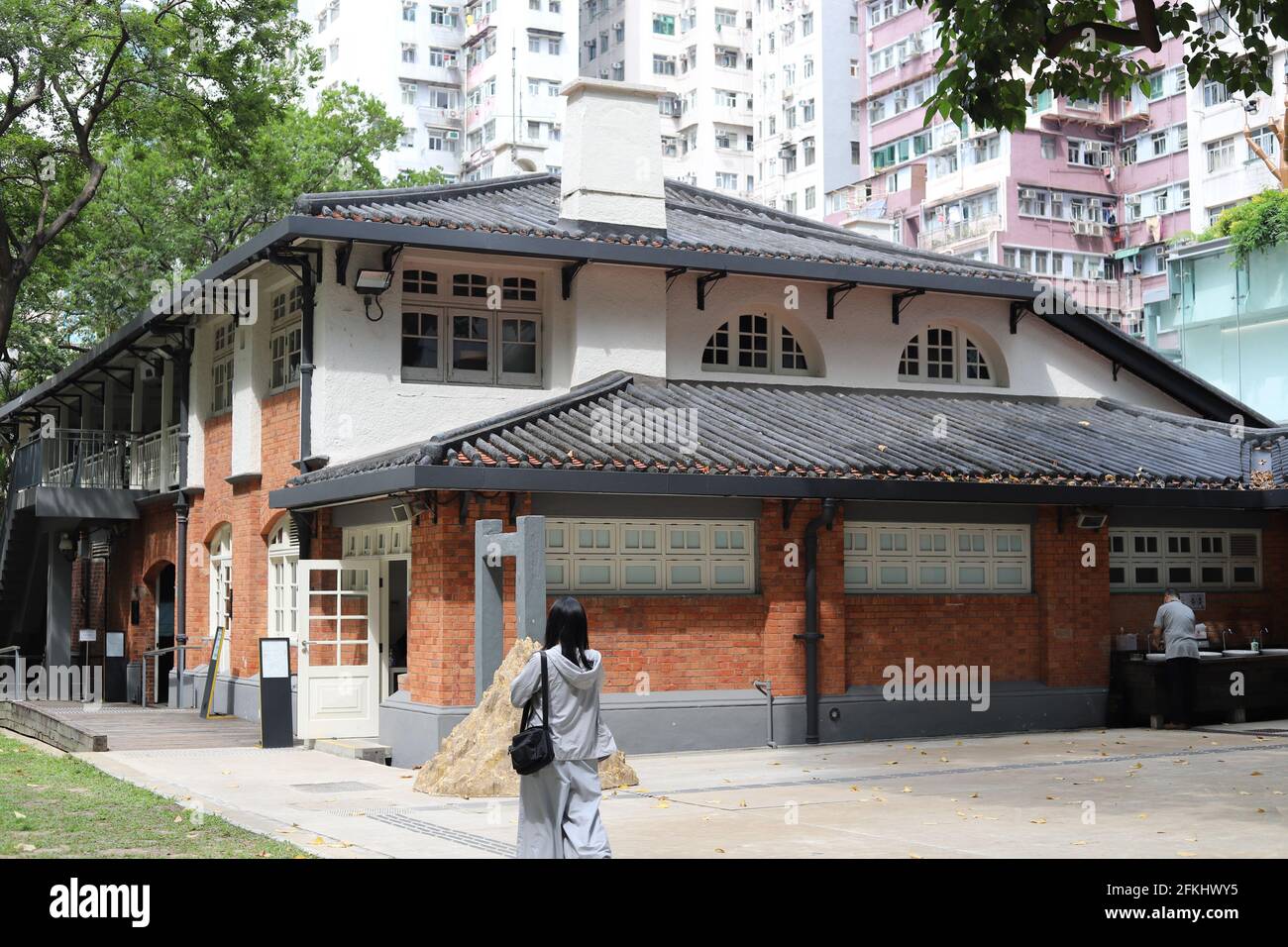 a historical traditional Chinese building with red bricks and roof ...