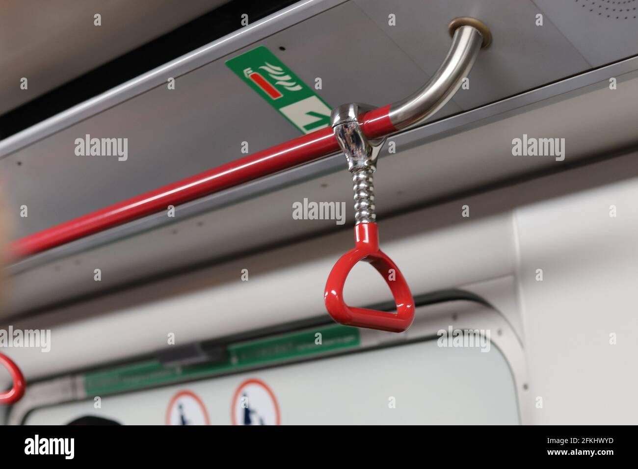 Close-up Subway or Metro Handrail, Hand holding red Handrail in Hong ...