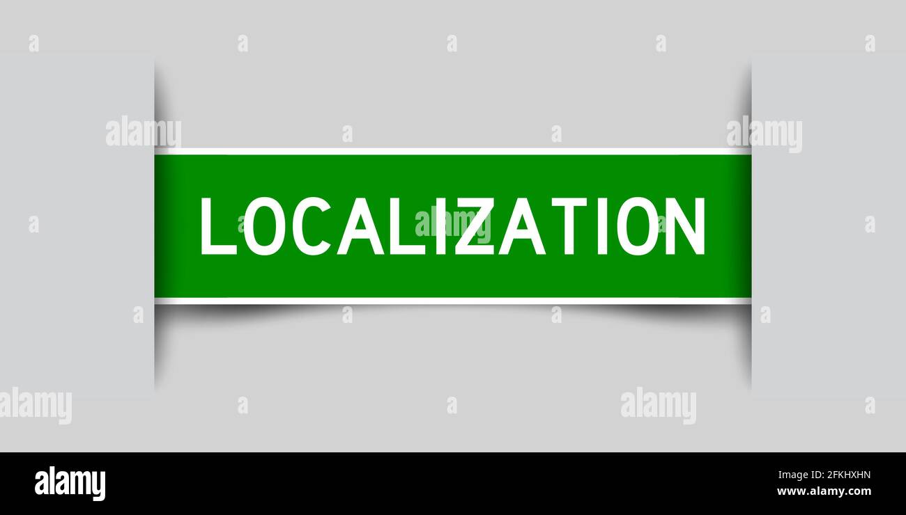 Inserted green color label sticker with word localization on gray ...