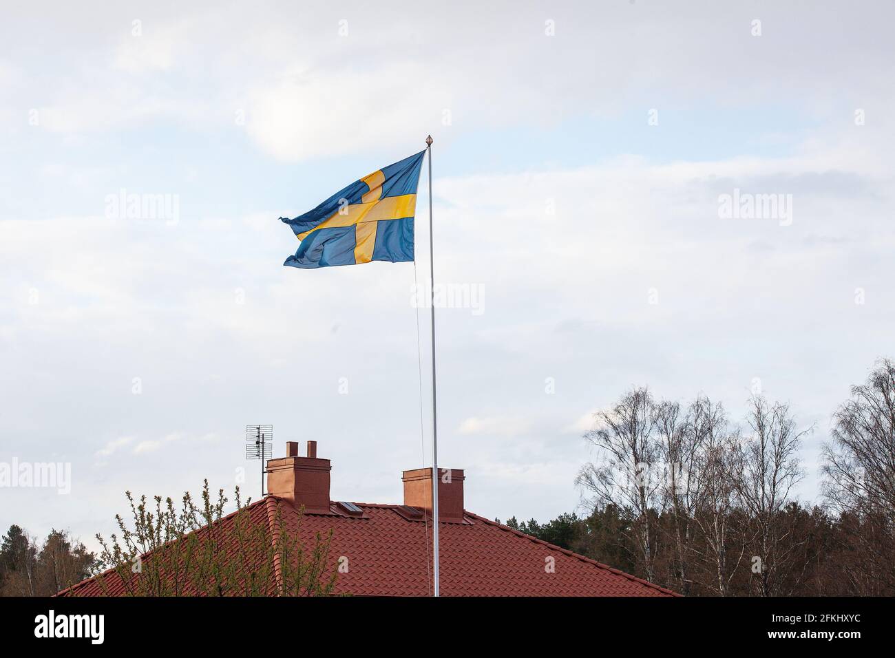 The Swedish flag in the wind Sweden Stock Photo - Alamy