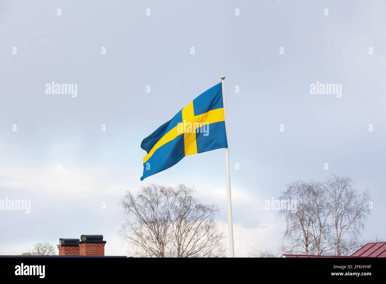 The Swedish flag in the wind Sweden Stock Photo - Alamy