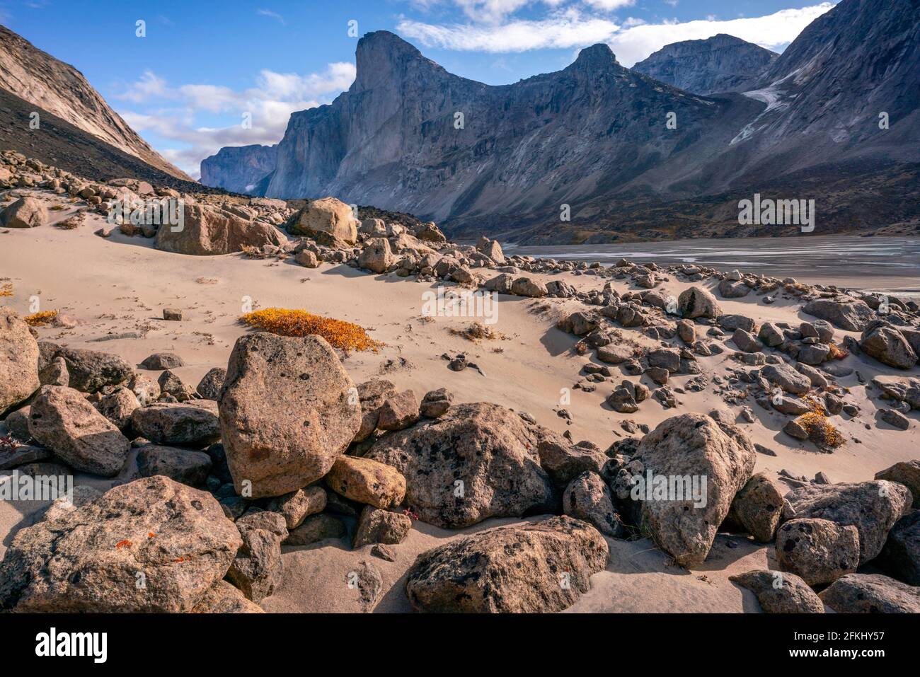 Southwest face of Mt. Thor, highest vertical cliff on Earth, on a ...