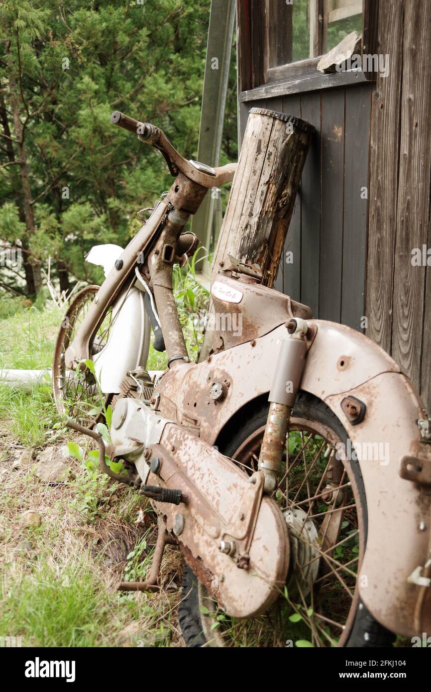 Kowada, Shizuoka, Japan, 04-22-2021, Abandoned rusted motorbike outside ...
