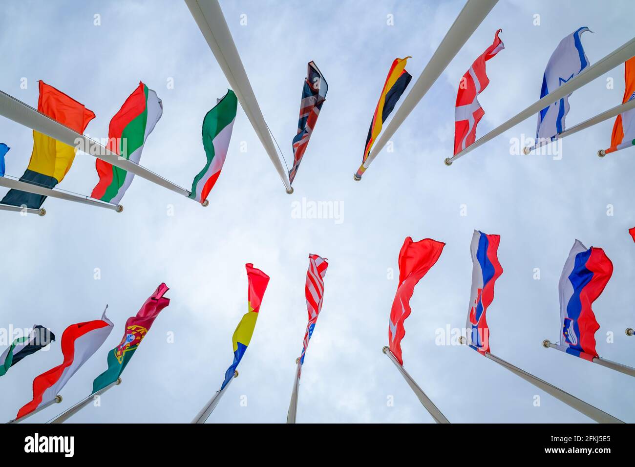 Flags of different countries on flagpoles Stock Photo - Alamy