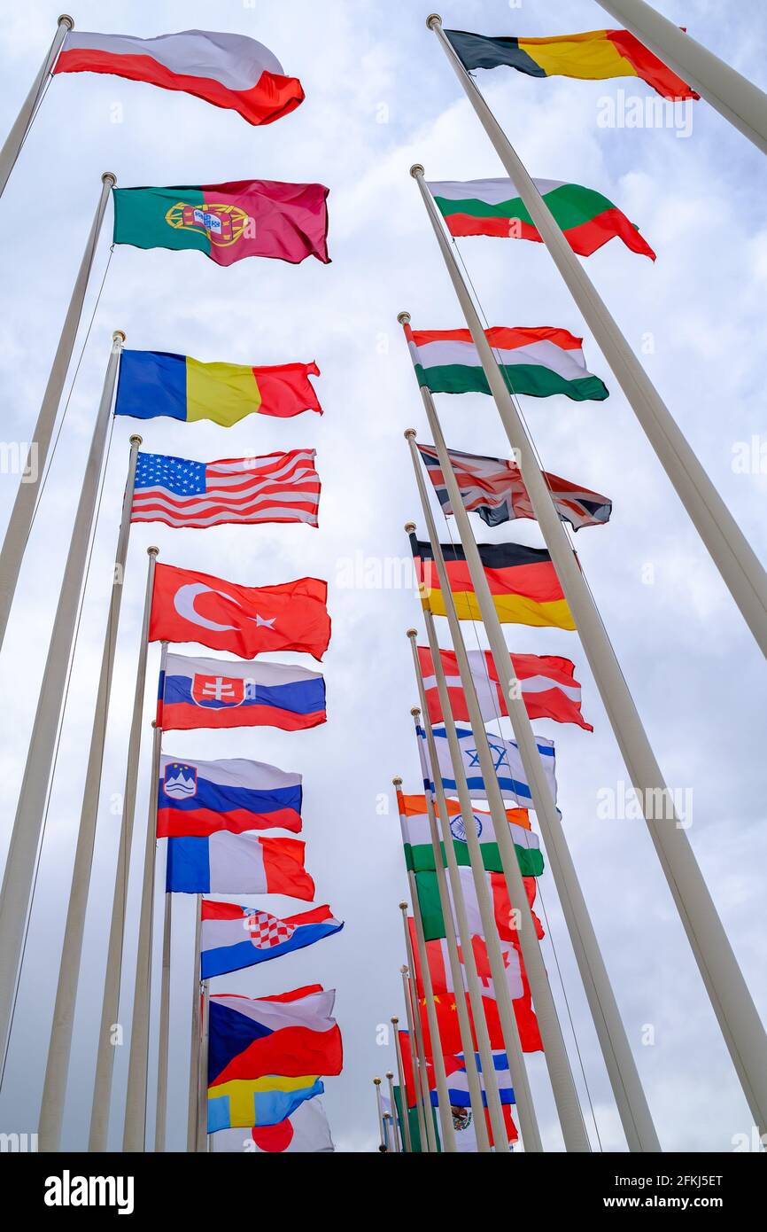Flags of different countries on flagpoles Stock Photo - Alamy