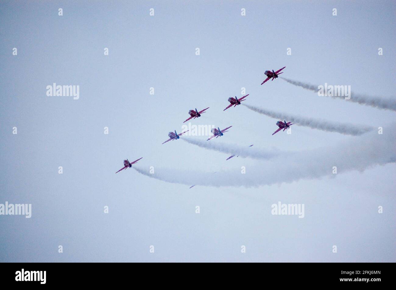 Red arrows display team flying at air show Jersey Stock Photo - Alamy