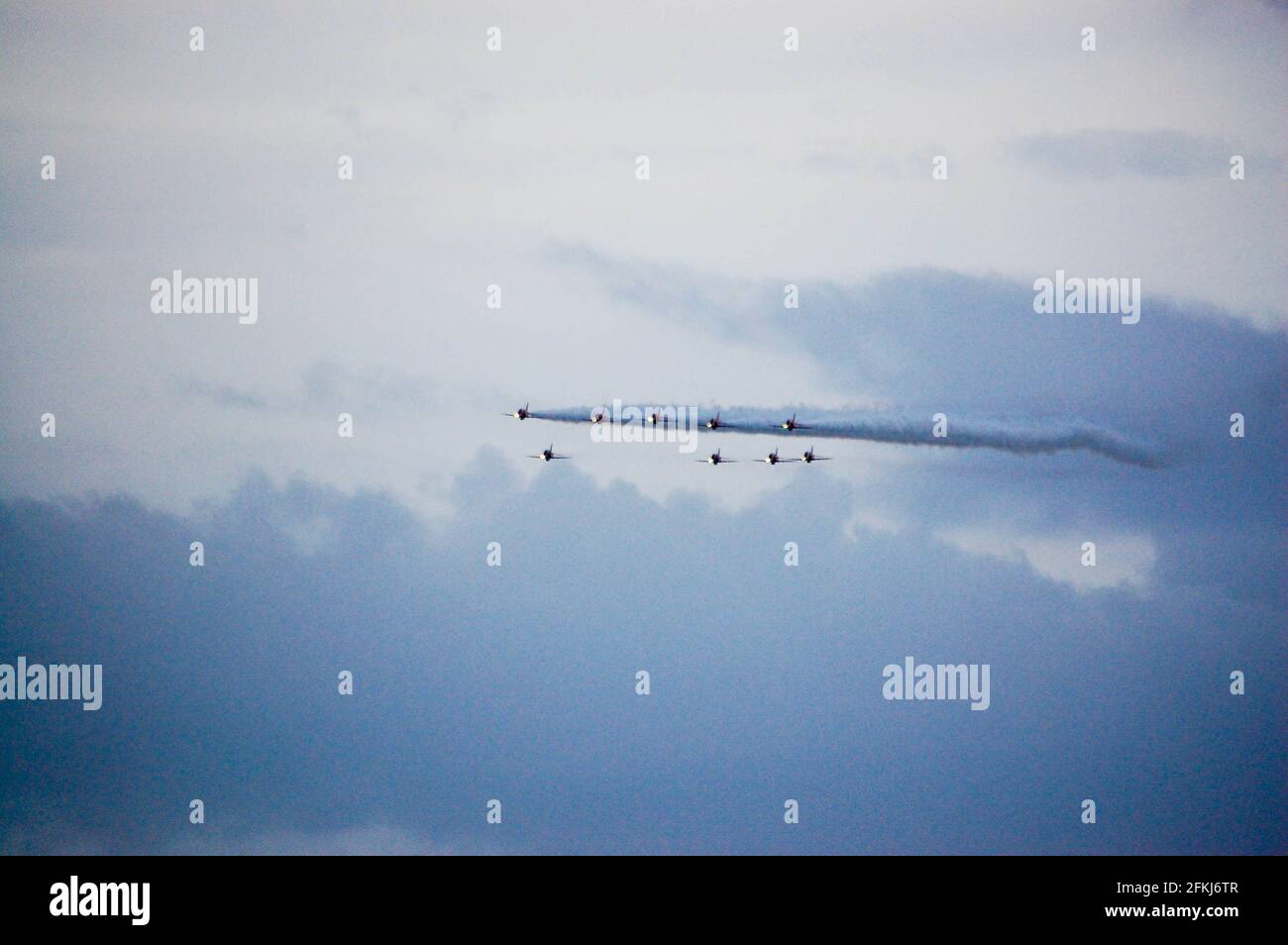 Red arrows display team flying at air show Jersey Stock Photo - Alamy