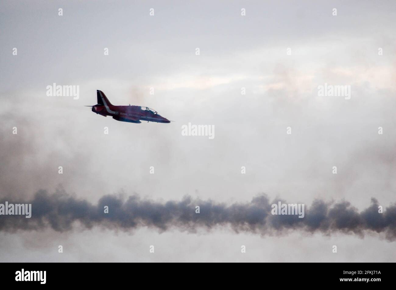 Red arrows display team flying at air show Jersey Stock Photo - Alamy