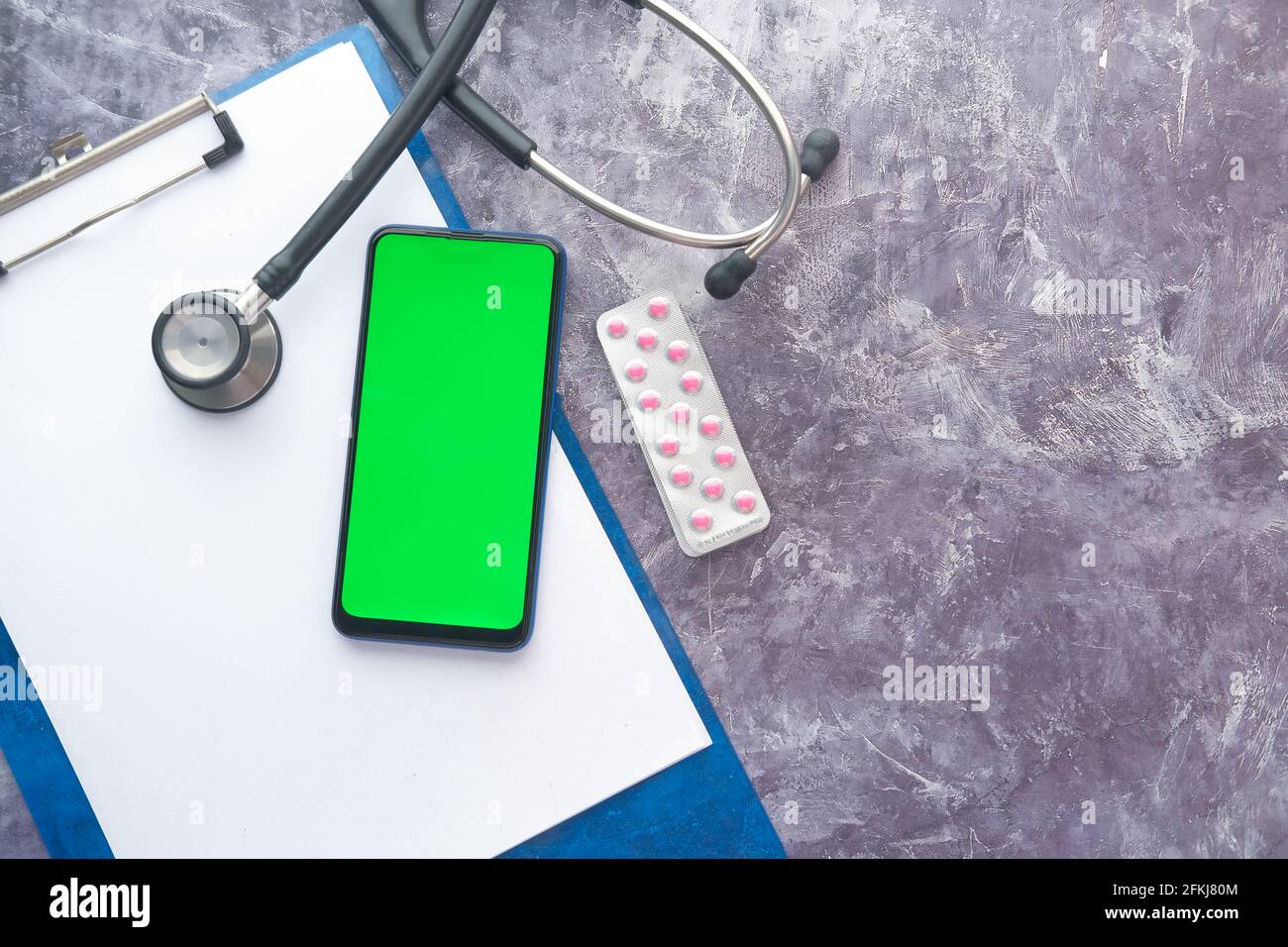 top view of smart phone and stethoscope on clinic table Stock Photo - Alamy