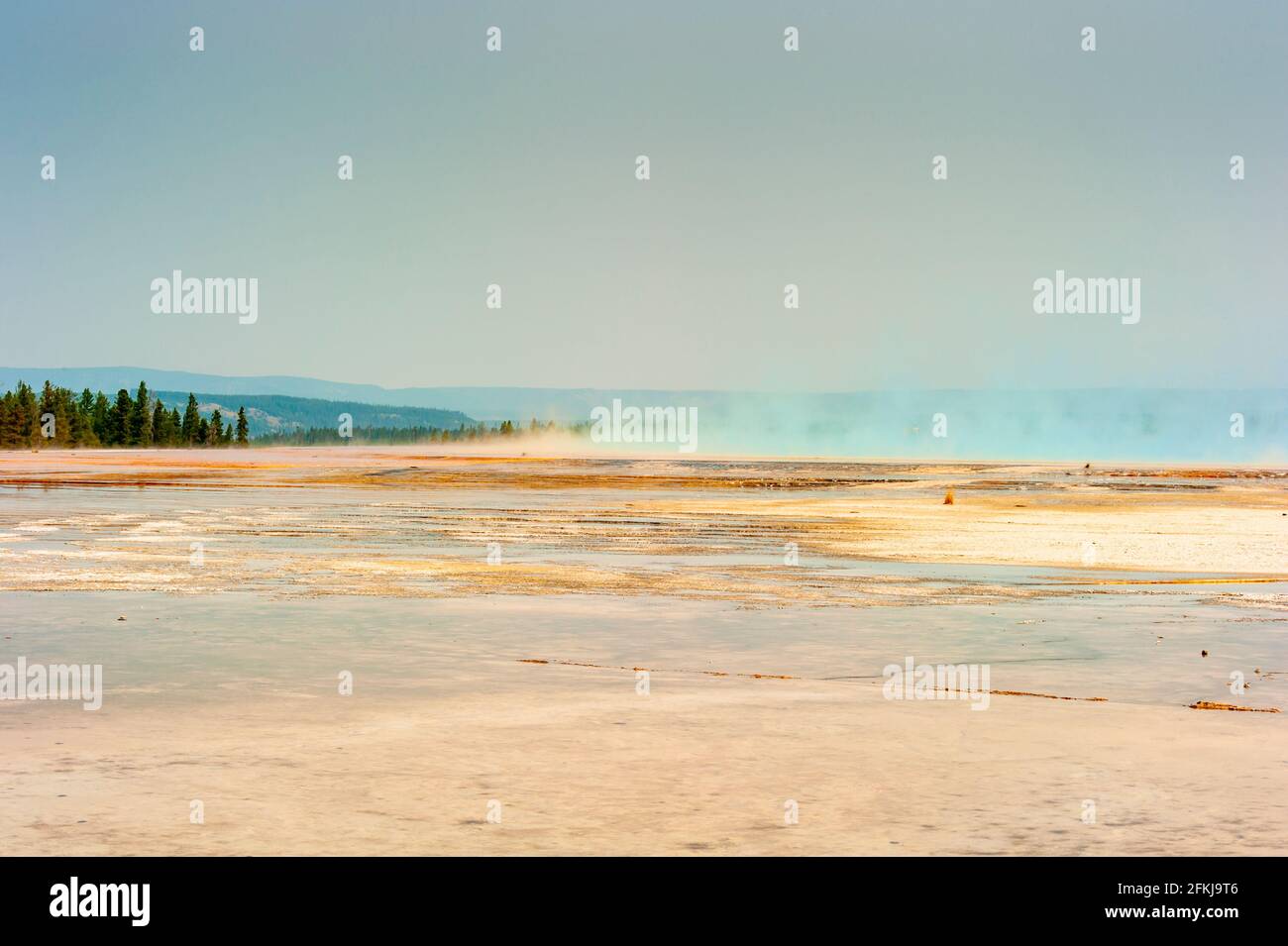 Distant side view of Grand Prismatic Spring on the Fairy Falls trail ...