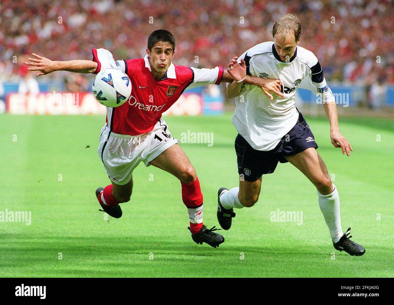 Silvinho Arsenal August 1999holds off the challenge of Jordi Cruyff ...