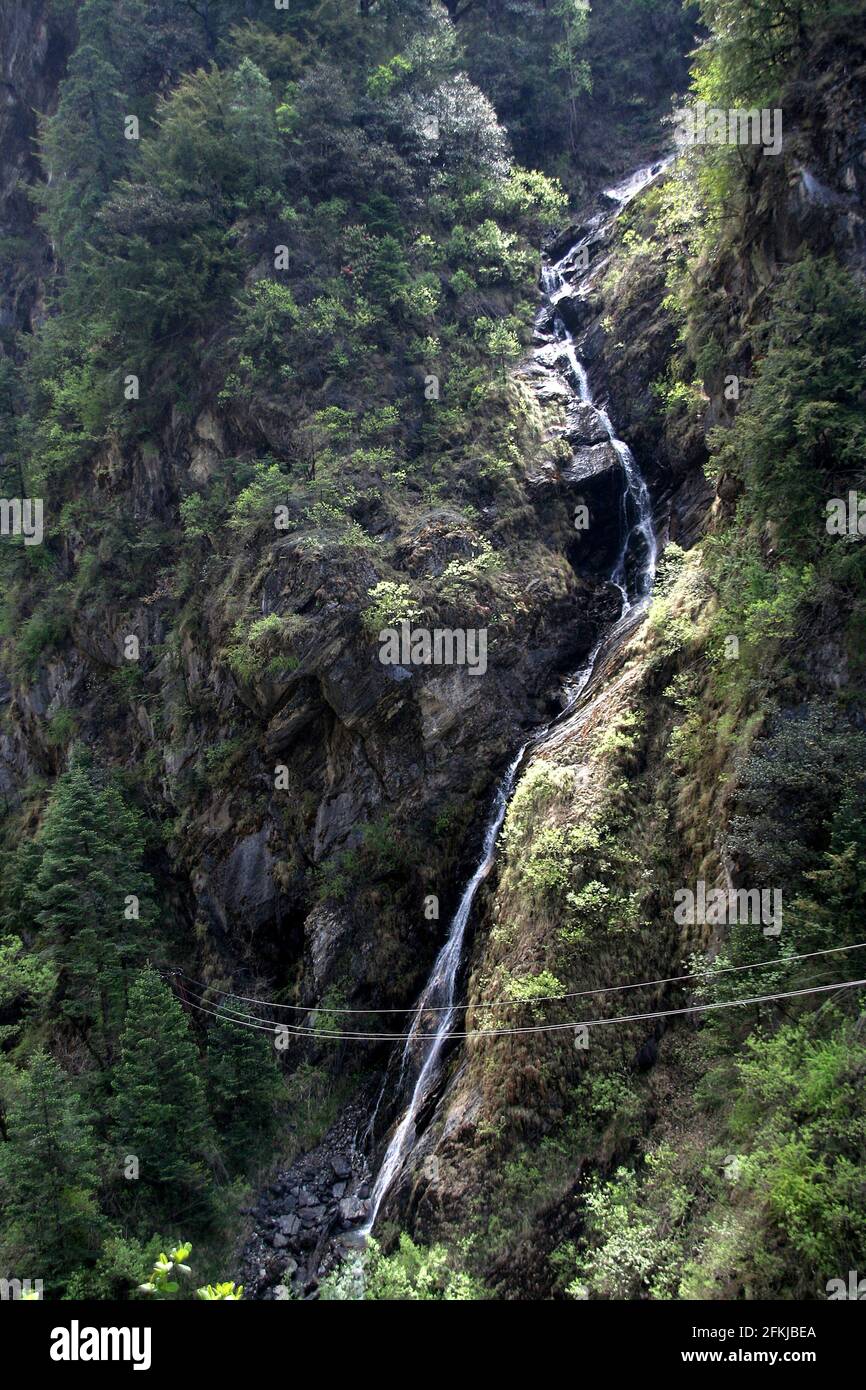 A brook flows through a great height along s-shaped rocky path Stock ...