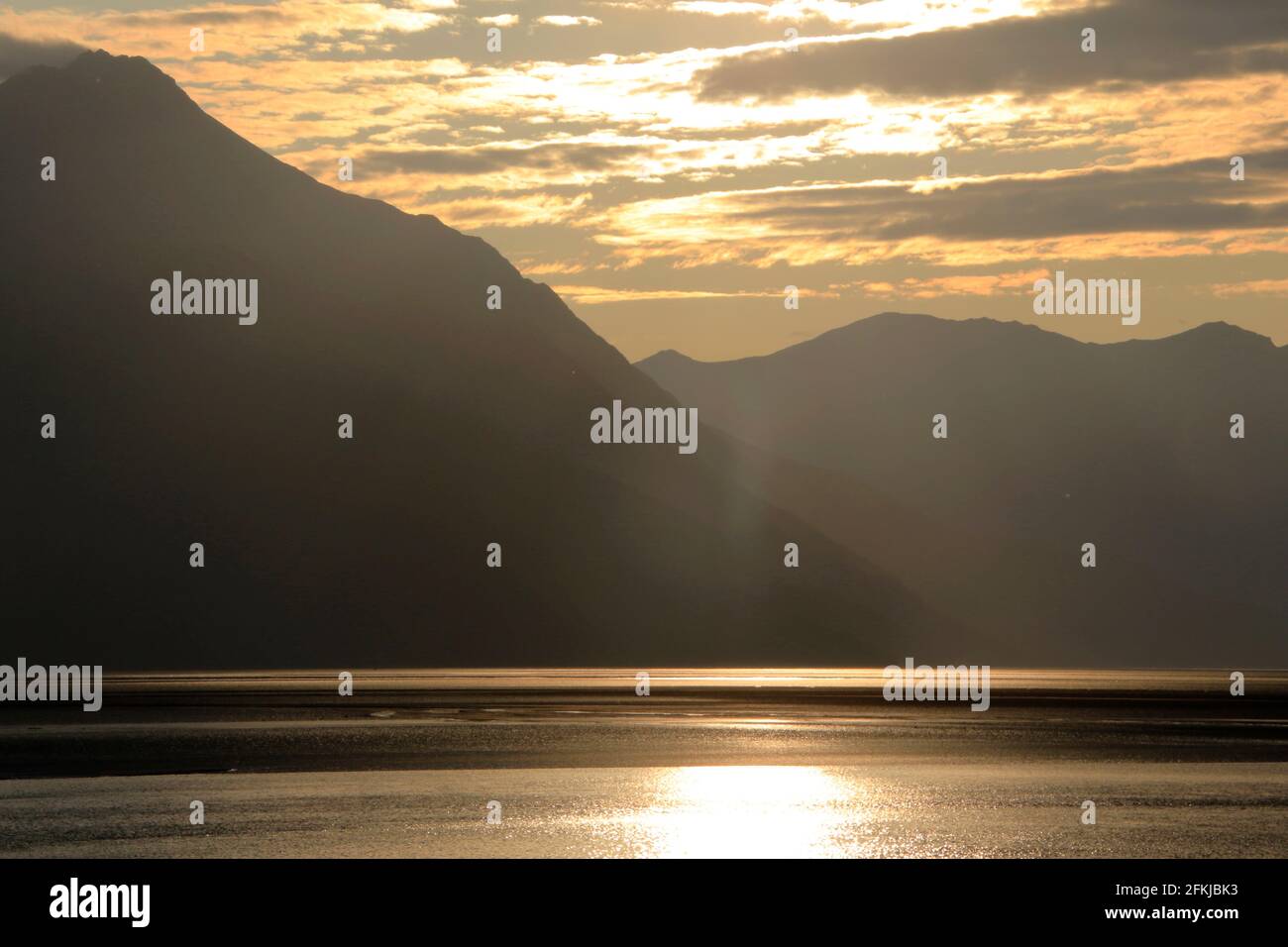Evening scene of mountains and the sea near Anchorage Alaska USA Stock ...