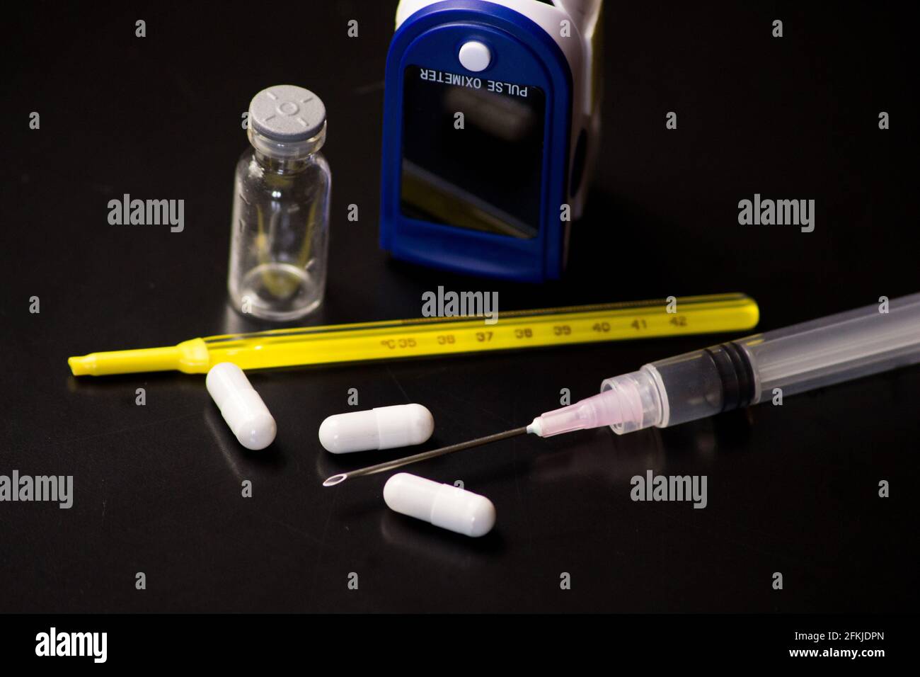 Medicine and drug concept. Medical ampoules, syringe and injection on ...