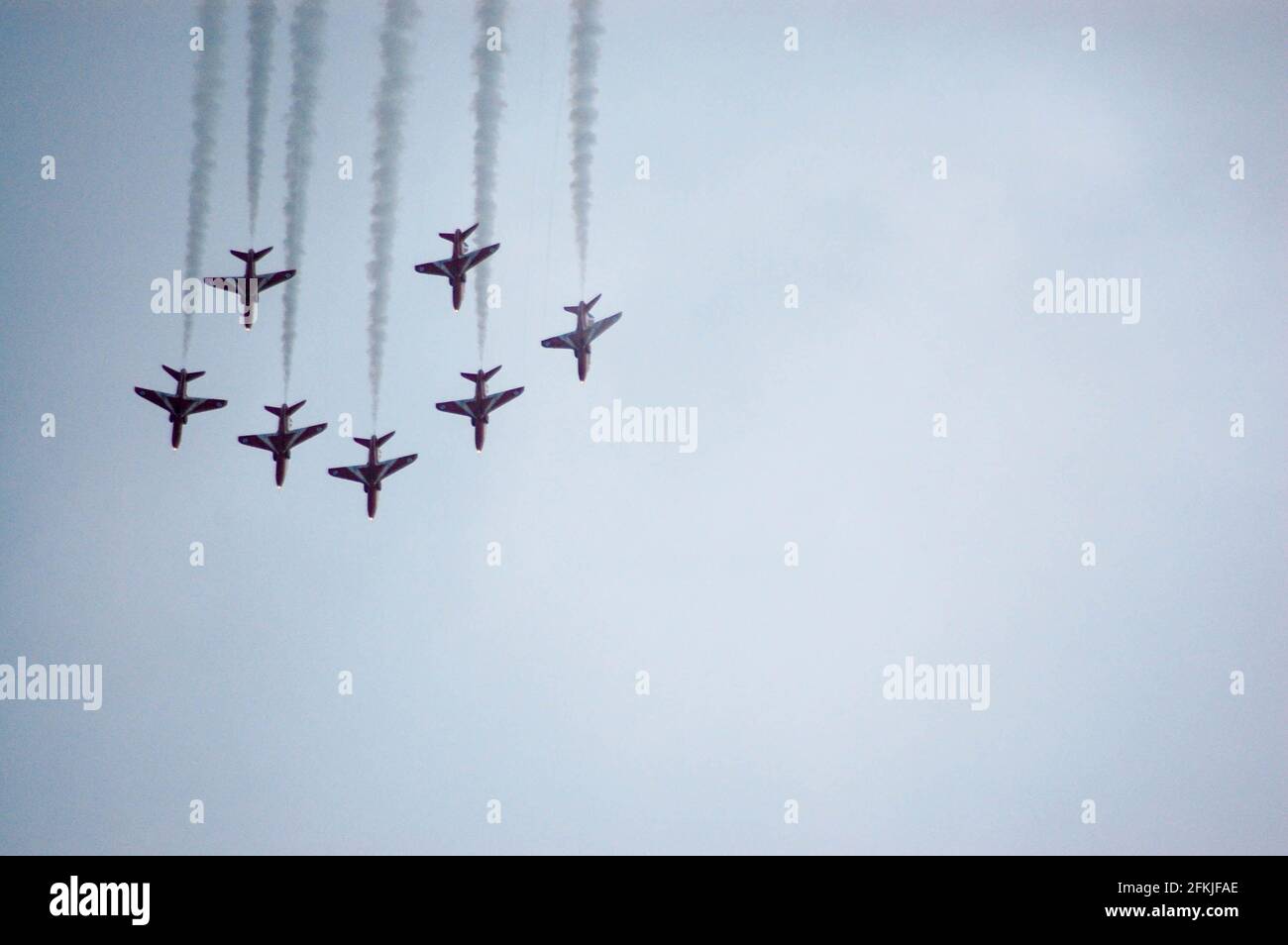 Red arrows display team flying at air show Jersey Stock Photo - Alamy
