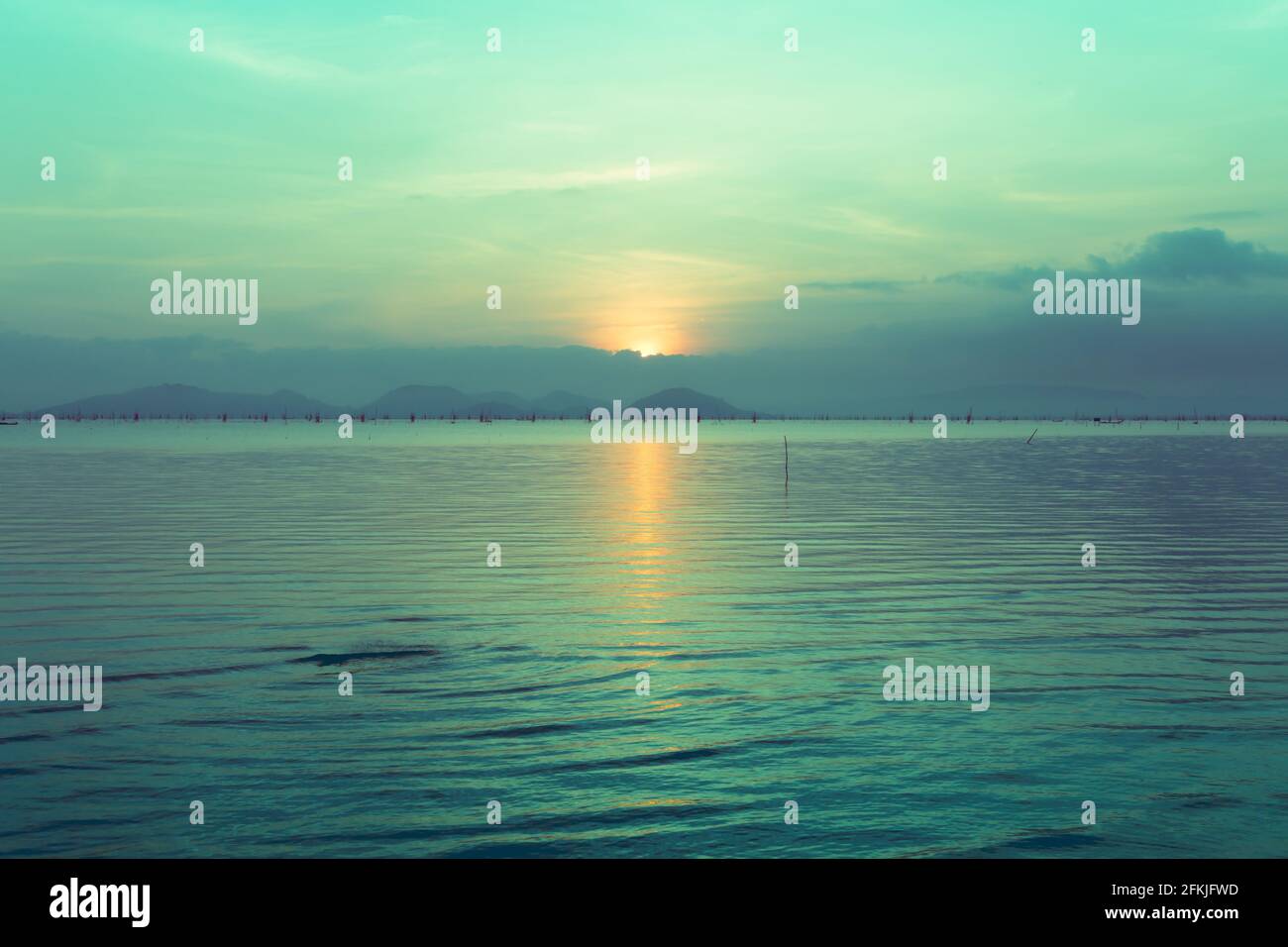 Fantastic view of the sea. Colorful sunset in the sea, green sky ...