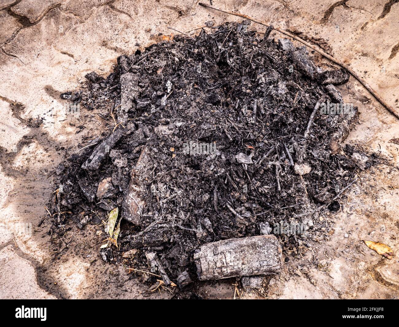 Pile of burnt garden waste Stock Photo - Alamy