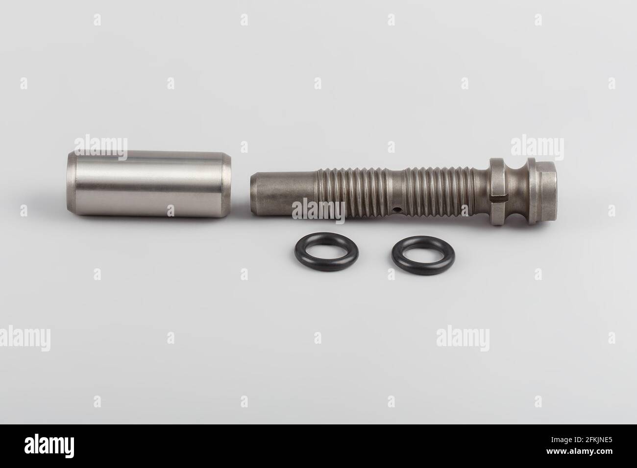 The repair kit for the spring from the pin bushing and gaskets lies on ...