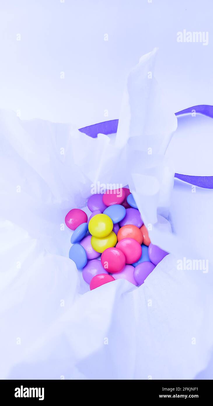 Colorful candy balls in a paper package Stock Photo - Alamy