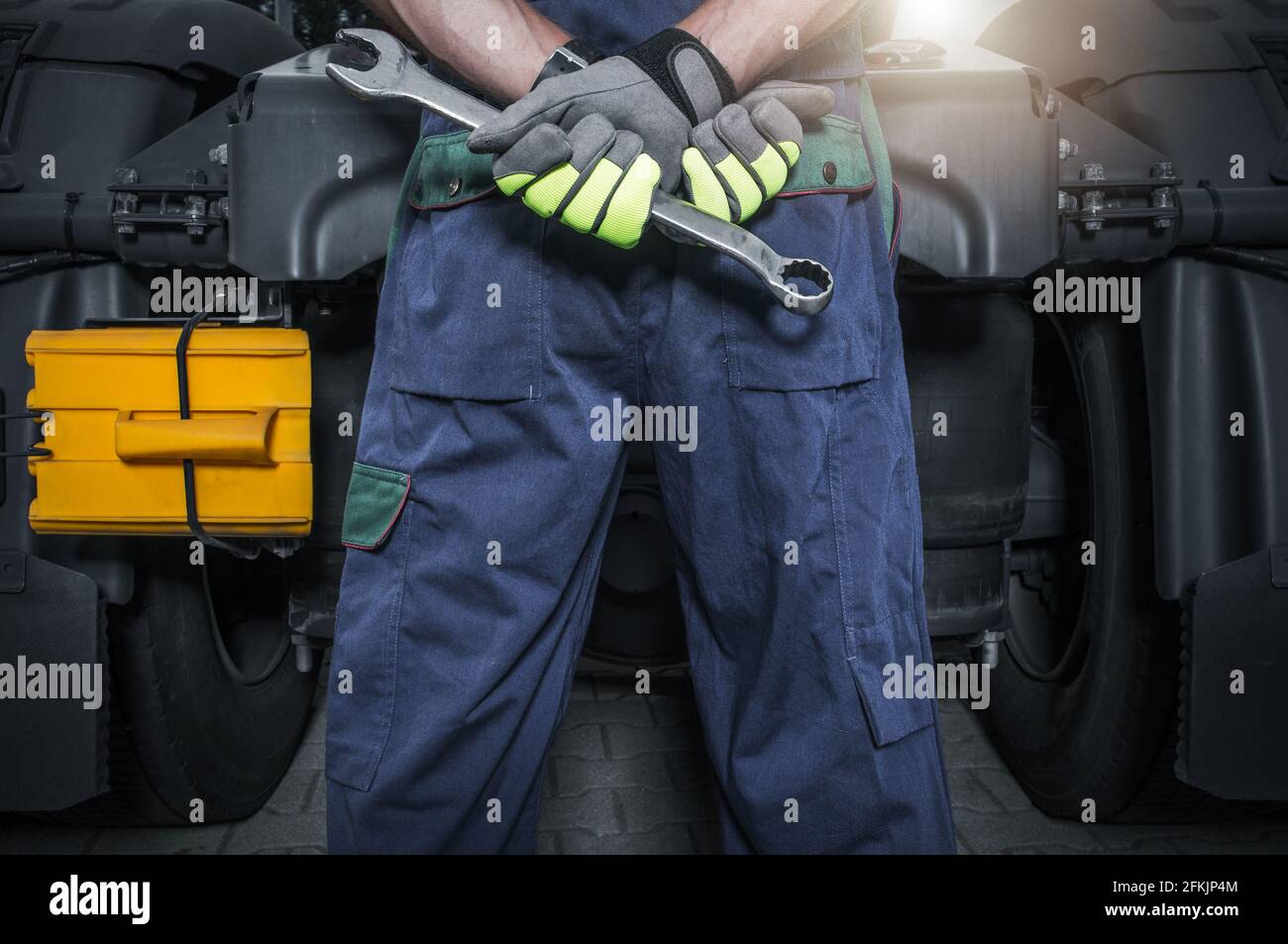 Truck Mechanic in Front of Tractor with Wrench in His Hands Staying ...