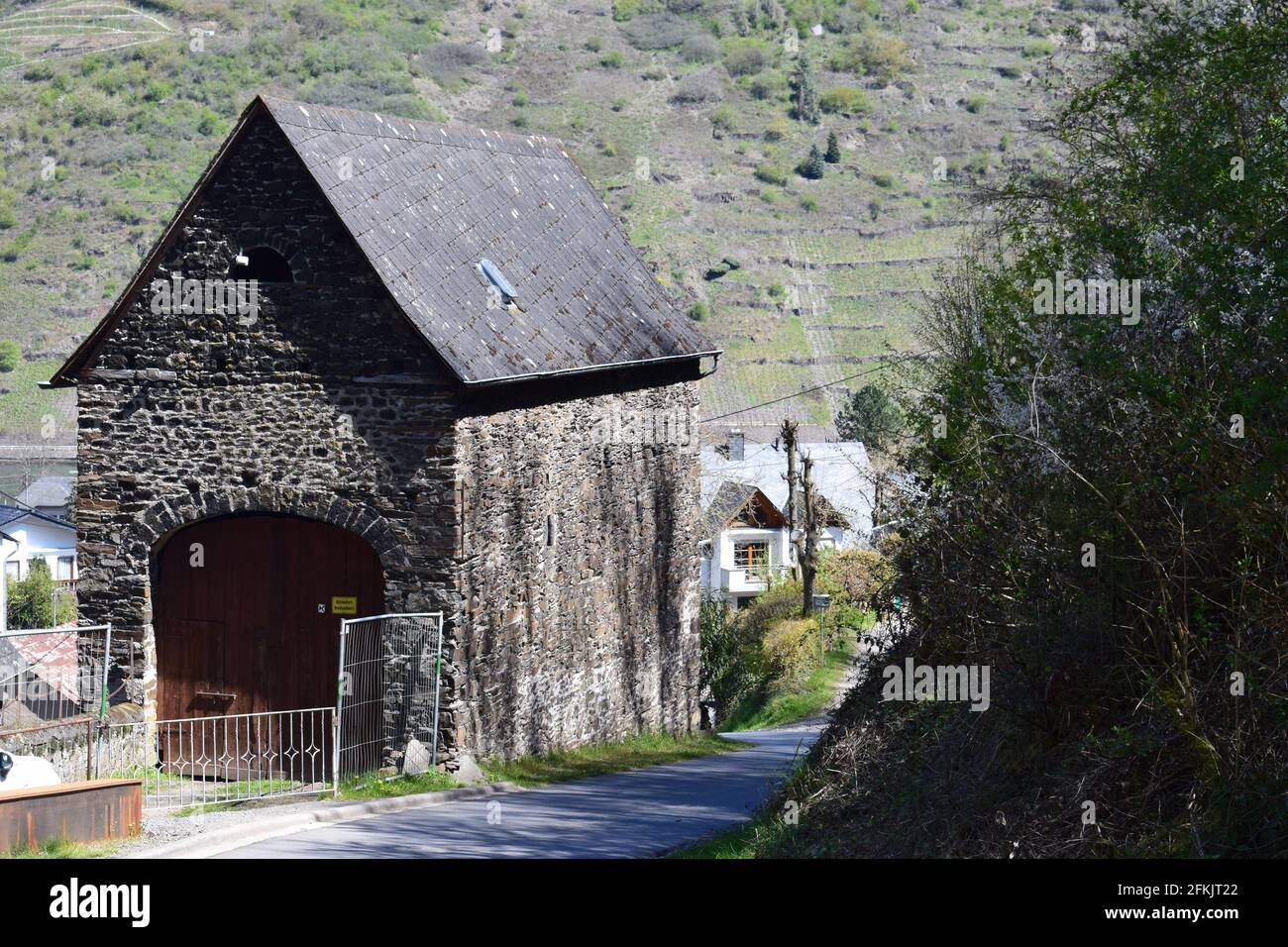 idyllic valley with steep road and old mills Stock Photo - Alamy