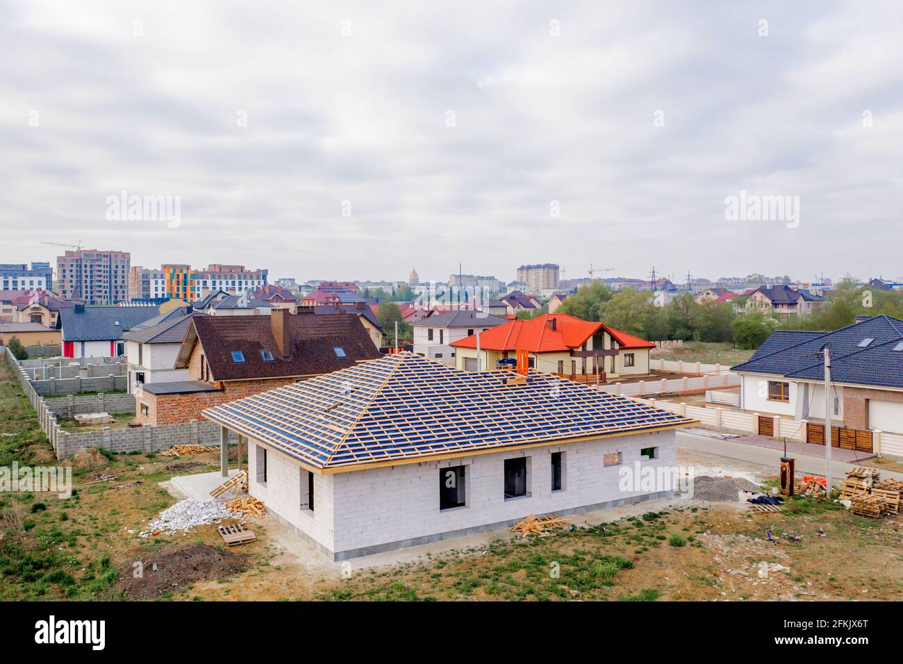 Residential house with wooden roof frame structure under construction ...