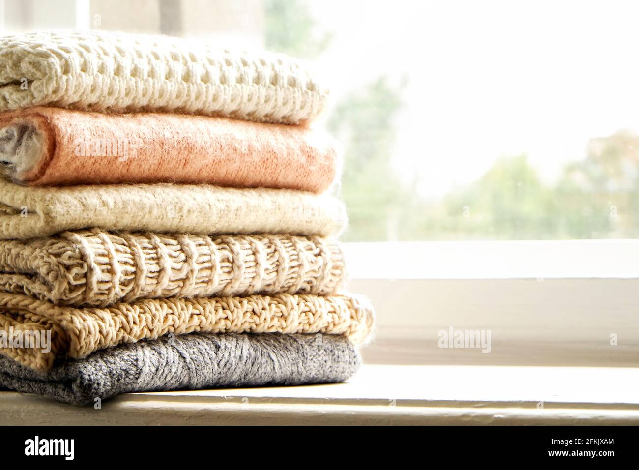 Folded jumper hi-res stock photography and images - Alamy