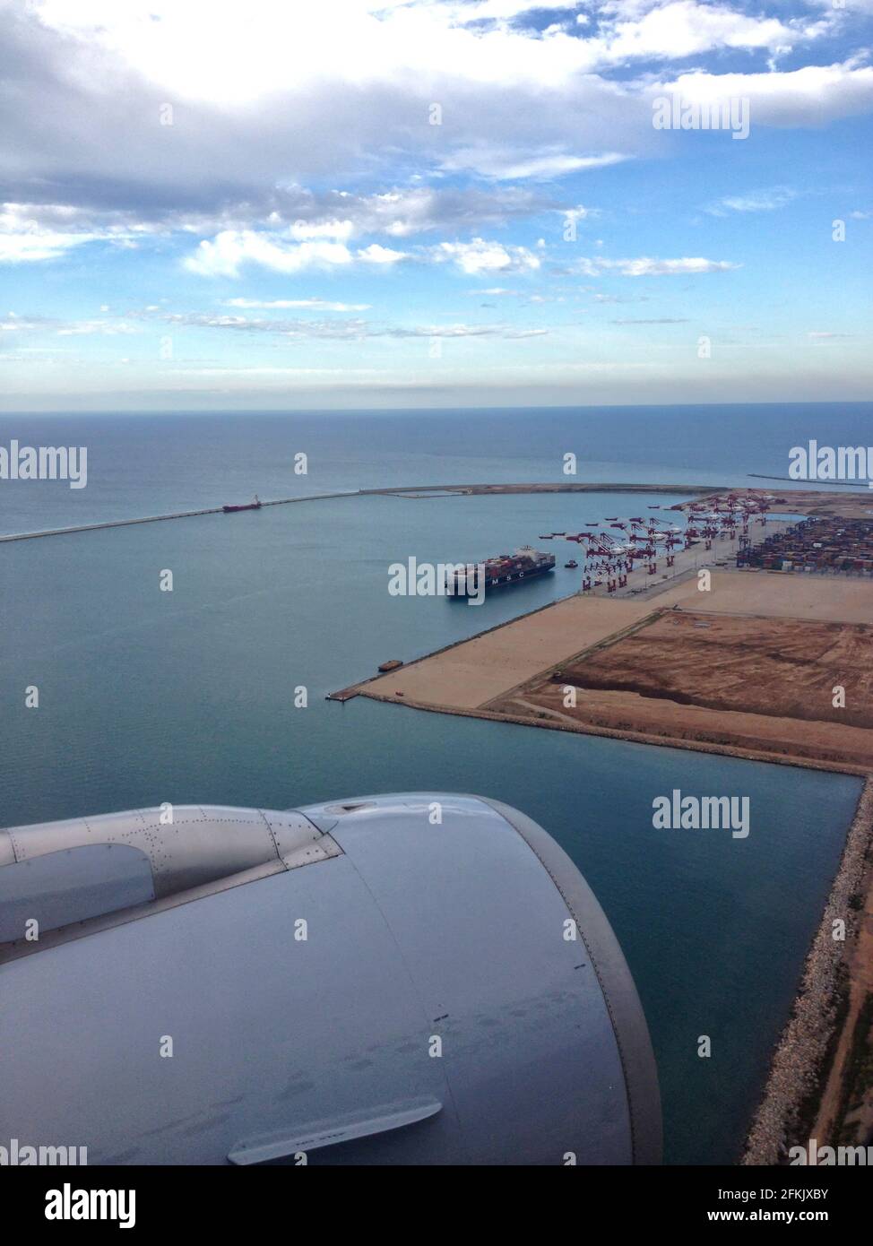 A view of a coastal city from a plane window Stock Photo - Alamy