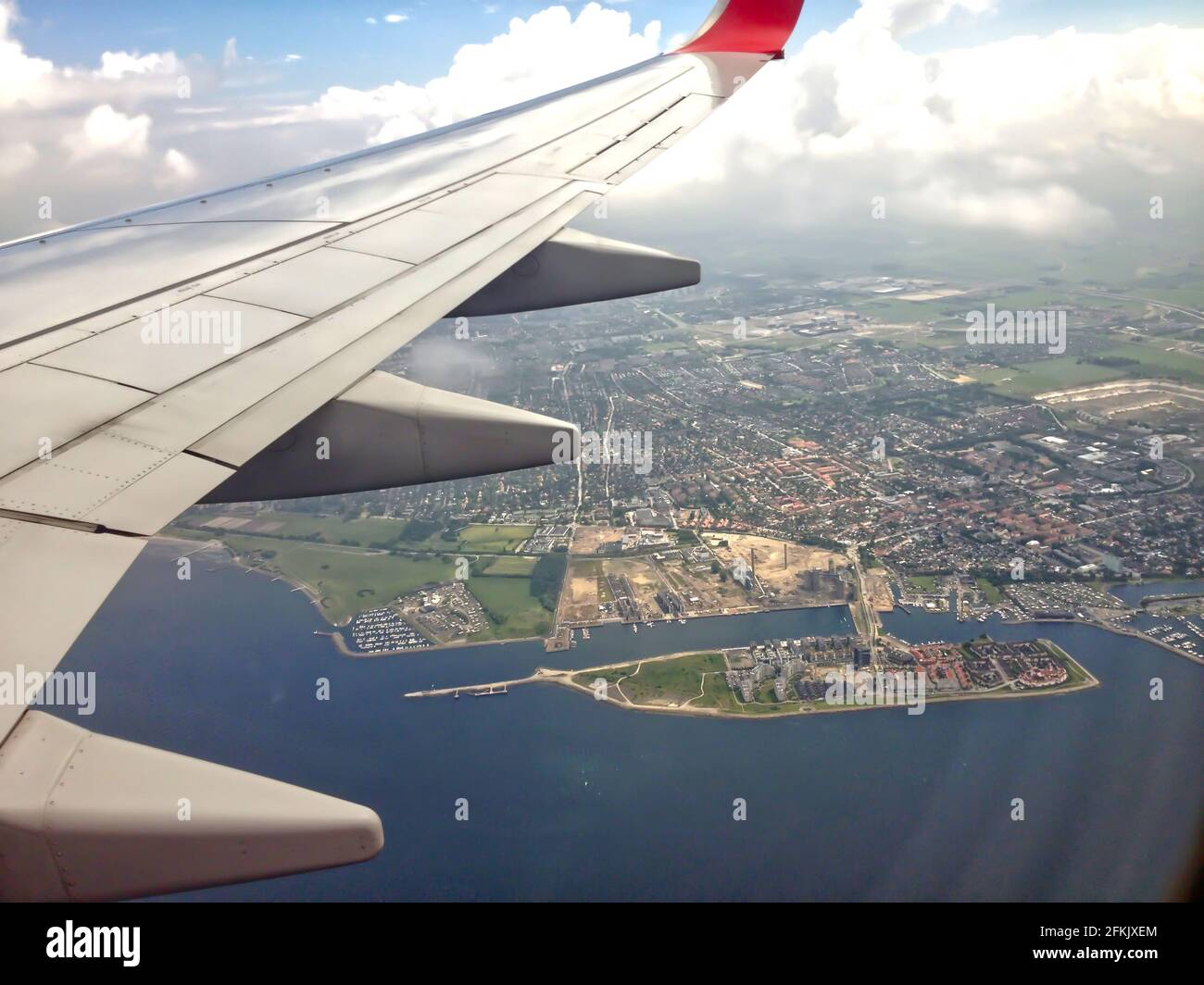 A view of a coastal city from a plane window Stock Photo - Alamy