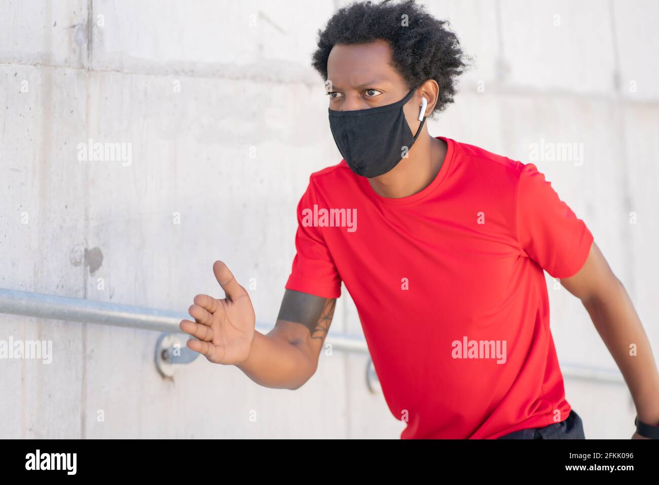 Athletic man running and doing exercise outdoors Stock Photo - Alamy
