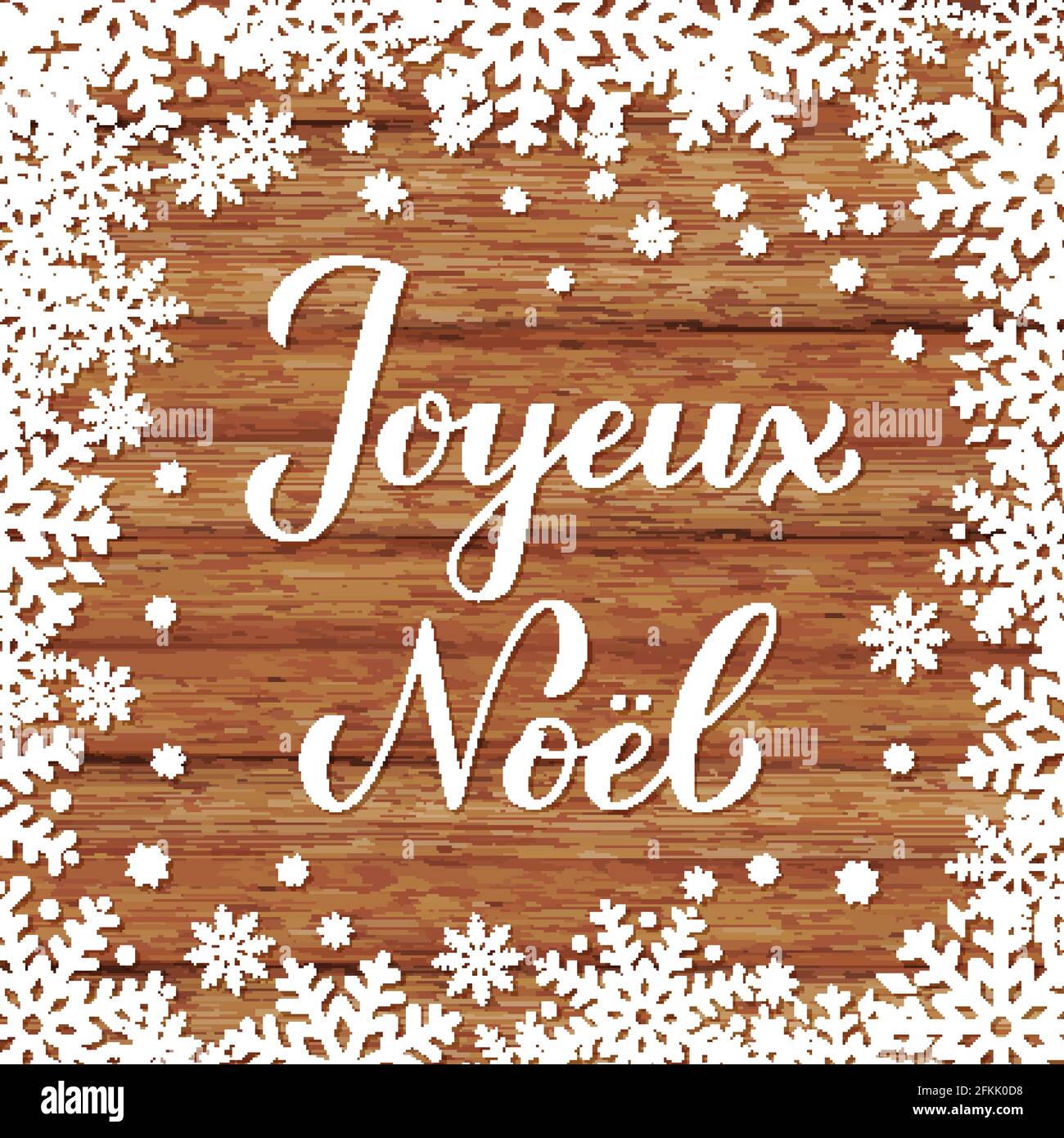 Joyeux Noel calligraphy hand lettering on wood background with ...