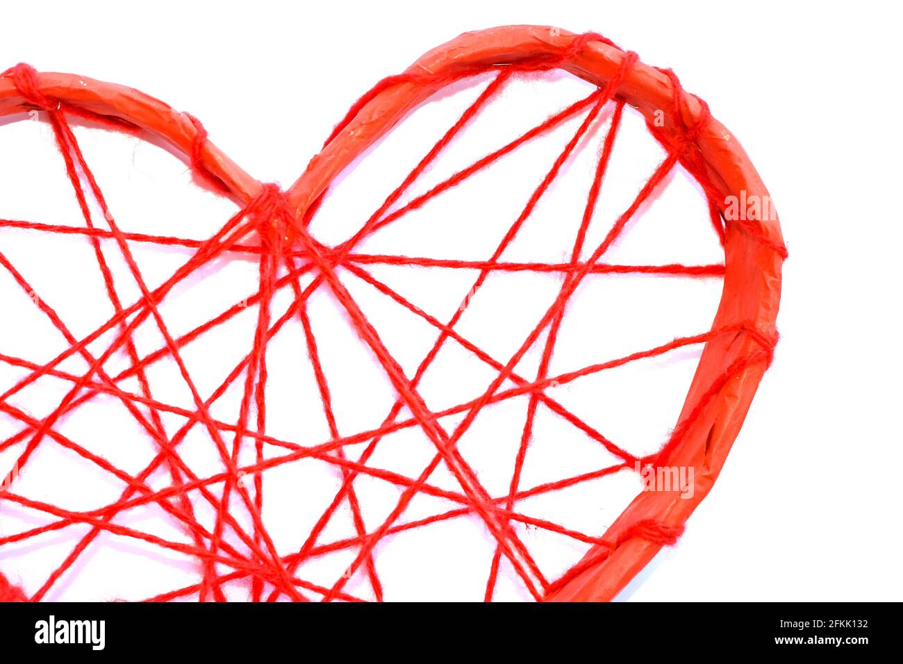 A paper heart tied with red threads. Heart on a white background Stock ...