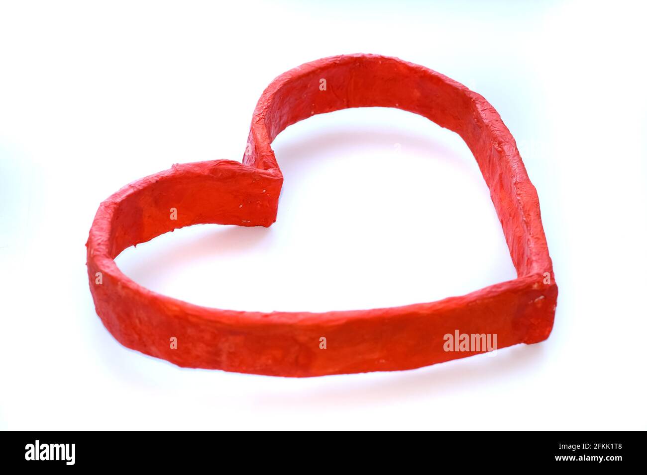 A symbol of the heart of red paper on a white background. Paper heart ...