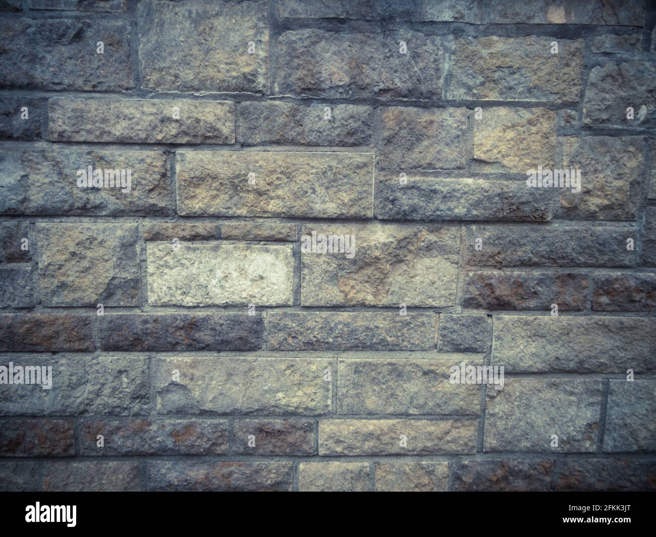 An outside wall texture with various-sized stones Stock Photo - Alamy