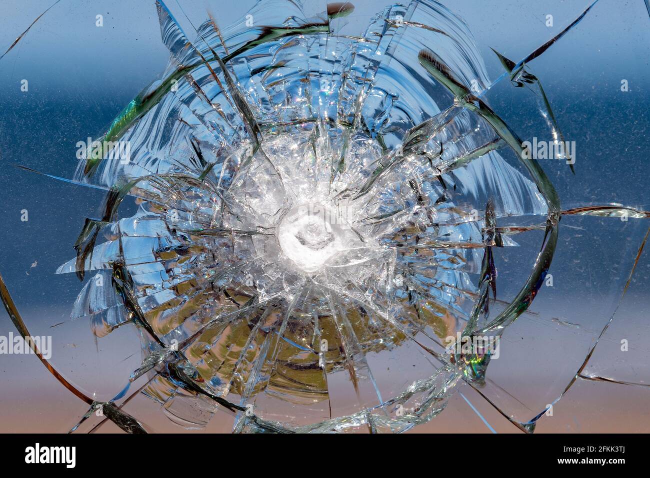 Impact fractures on window Stock Photo - Alamy