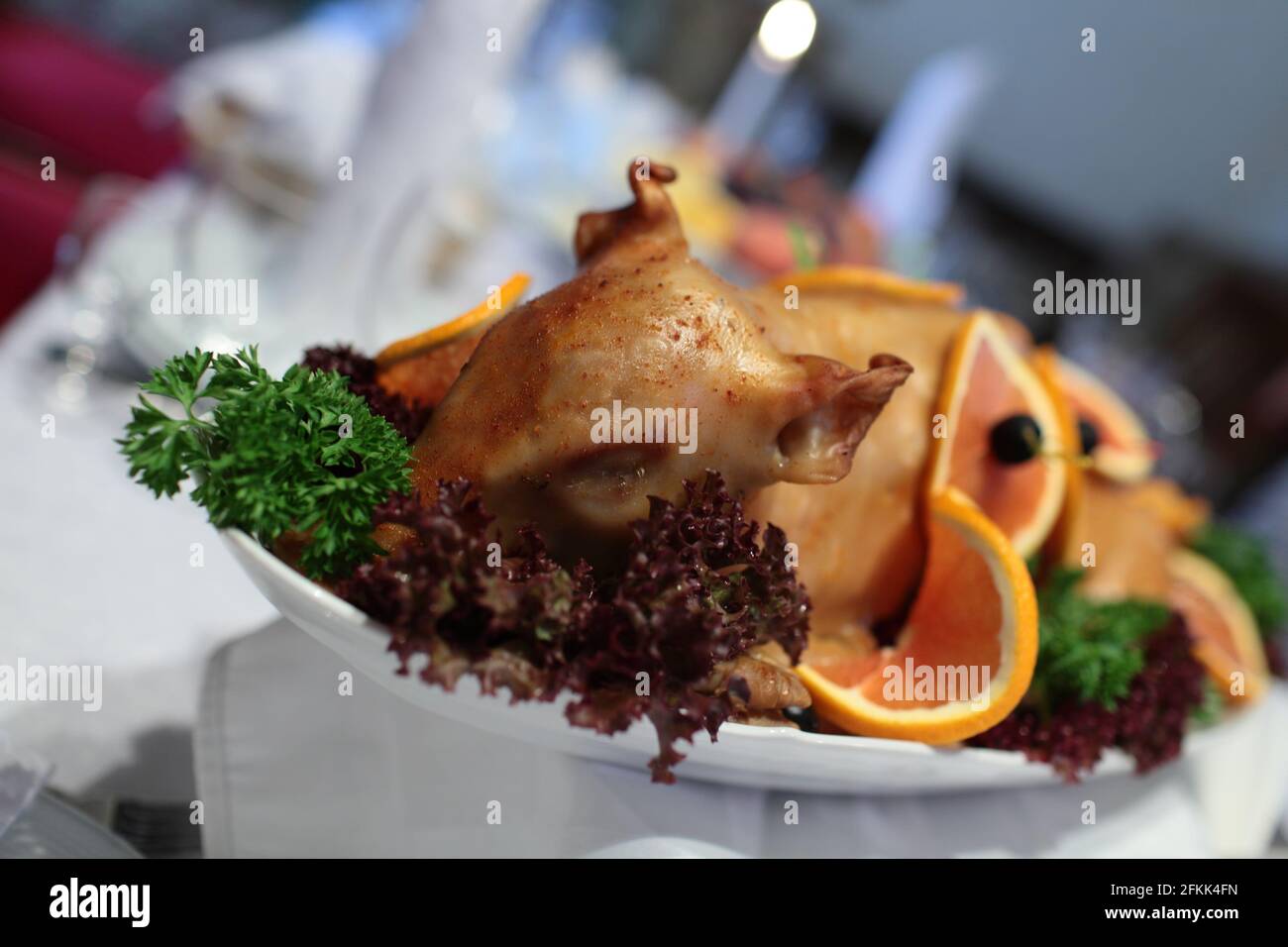 Roasted pig on a plate at the restaurant Stock Photo - Alamy