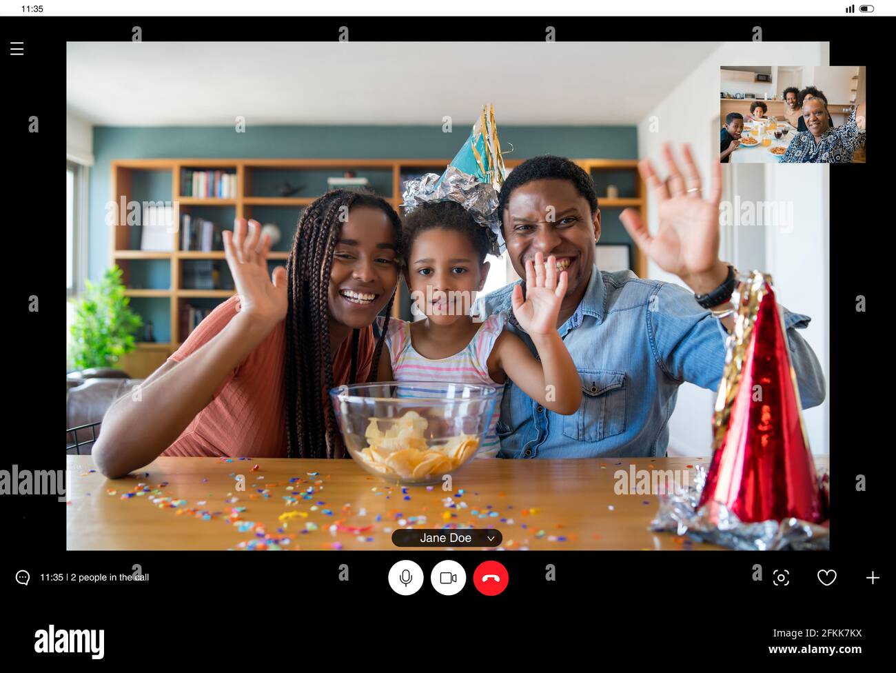 Family celebrating birthday on a video call Stock Photo - Alamy