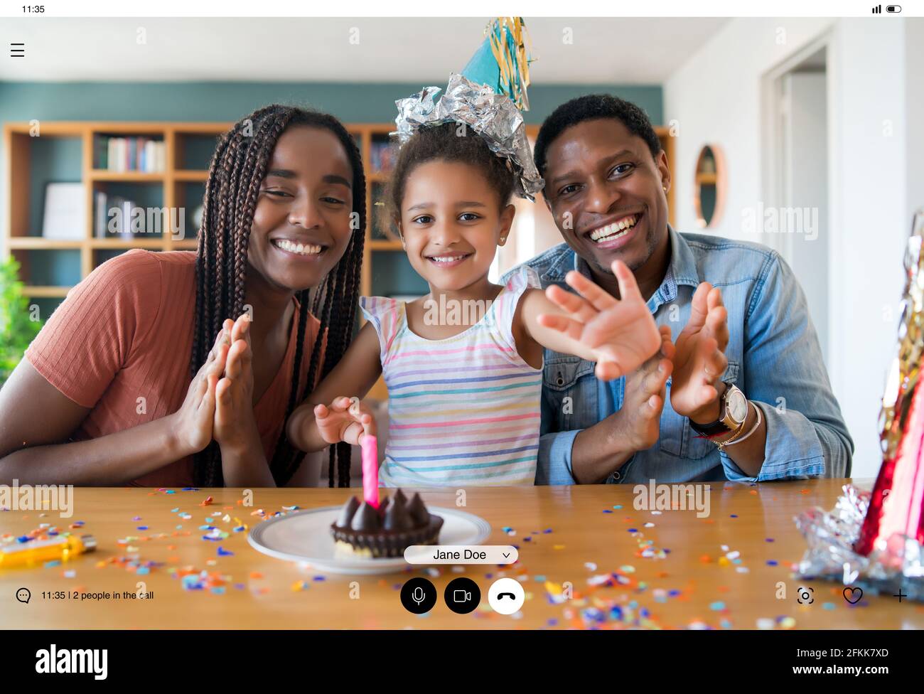 Family celebrating birthday on a video call Stock Photo - Alamy
