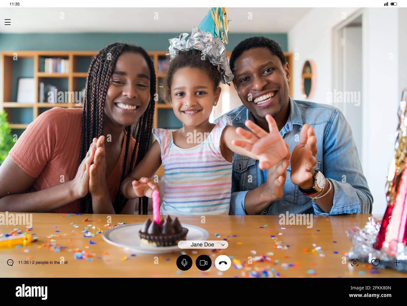 Family celebrating birthday on a video call Stock Photo - Alamy