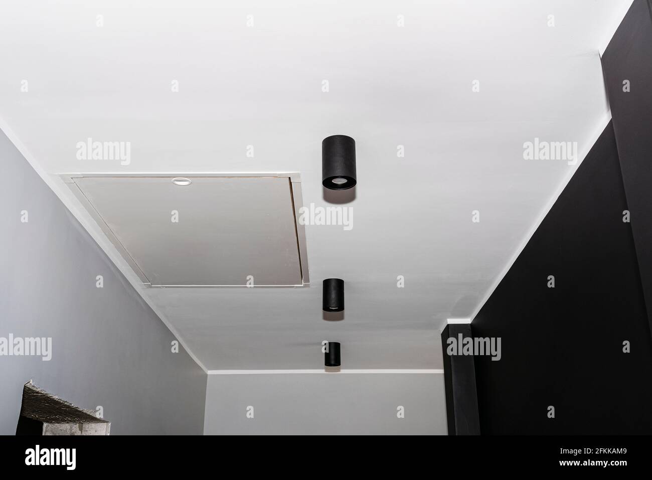 Modern LED lighting in the shape of a tube, covered with matt black ...